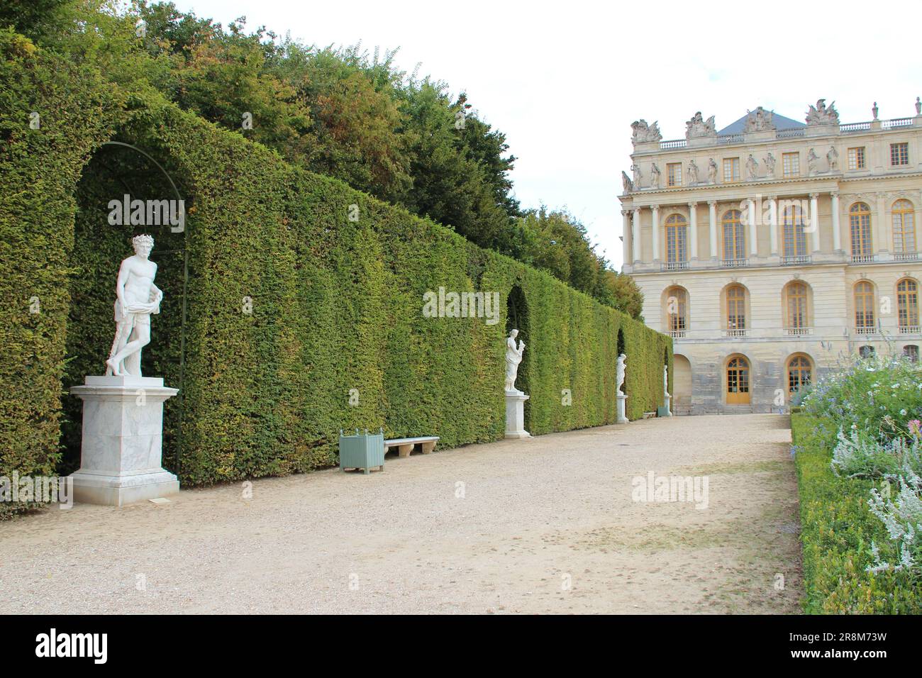 mythological statue in the gardens of the castle of versailles (france ...