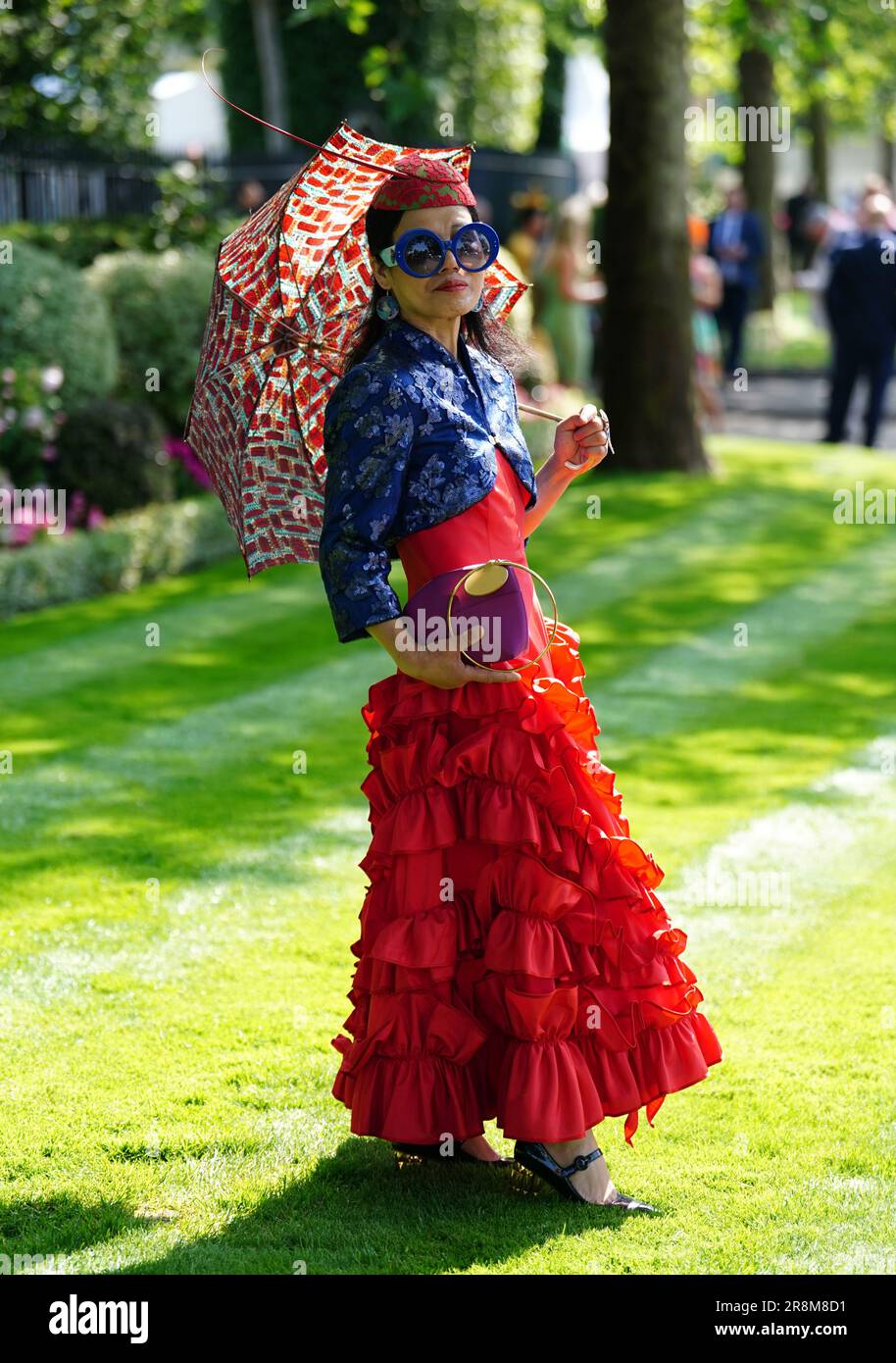 A racegoer arrives for day three of Royal Ascot at Ascot Racecourse ...