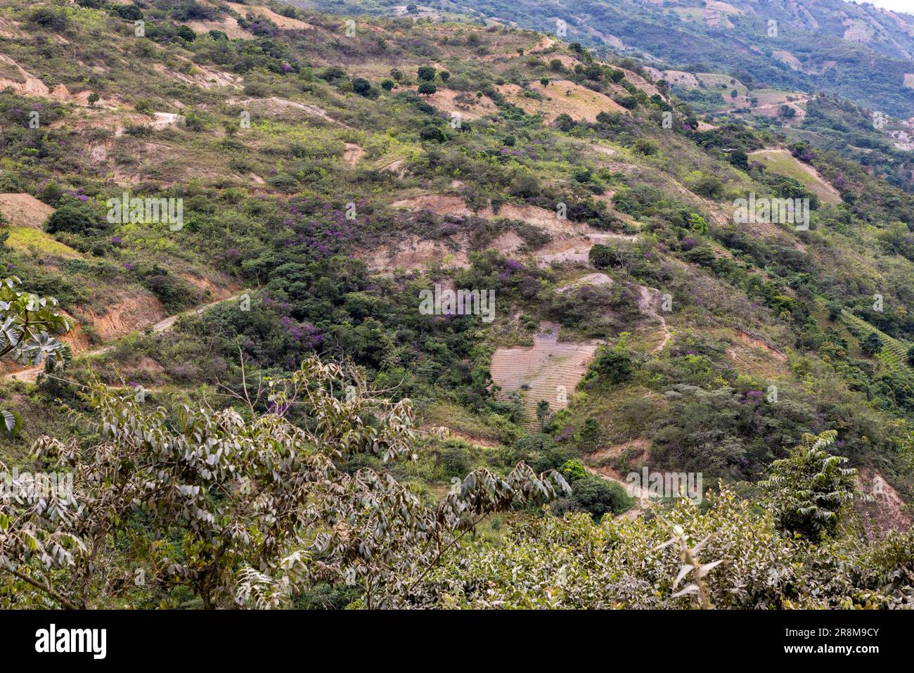 Scenic drive through the remote Bolivian Andes: passing small ...