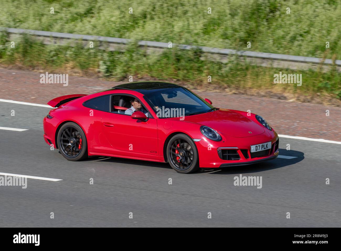 2018 Red Porsche 911 Carrera GTS S-A; travelling at speed on the M6 ...
