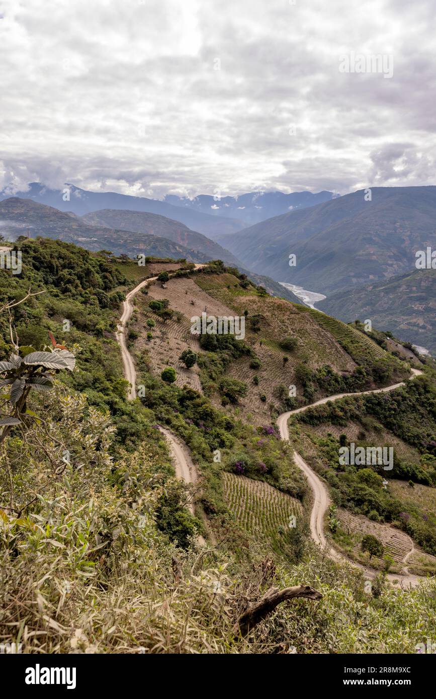 Scenic drive through the remote Bolivian Andes: passing small ...
