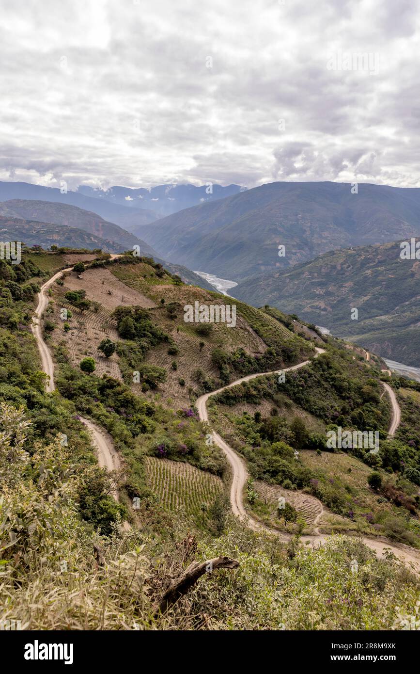 Scenic drive through the remote Bolivian Andes: passing small ...