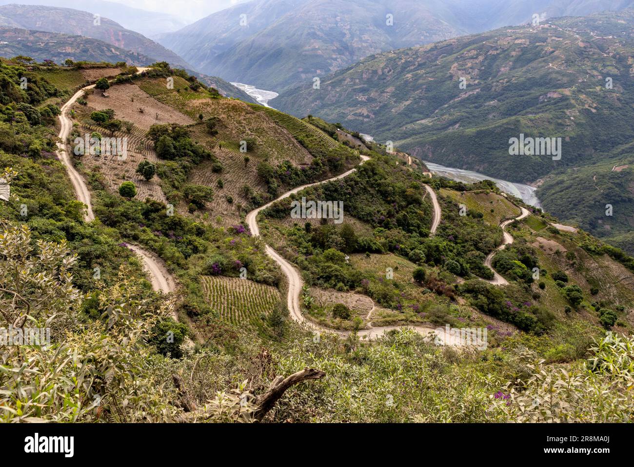 Scenic drive through the remote Bolivian Andes: passing small ...