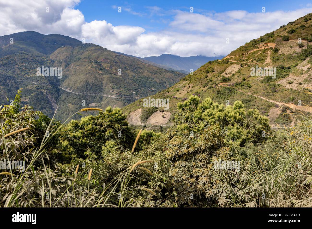 Scenic drive through the remote Bolivian Andes: passing small ...