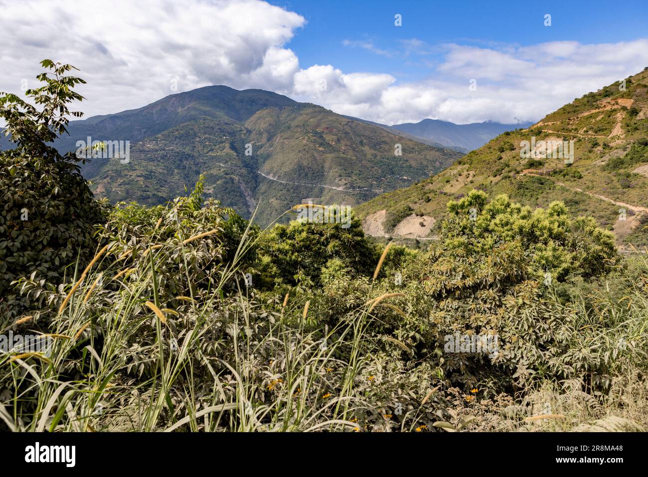Scenic drive through the remote Bolivian Andes: passing small ...