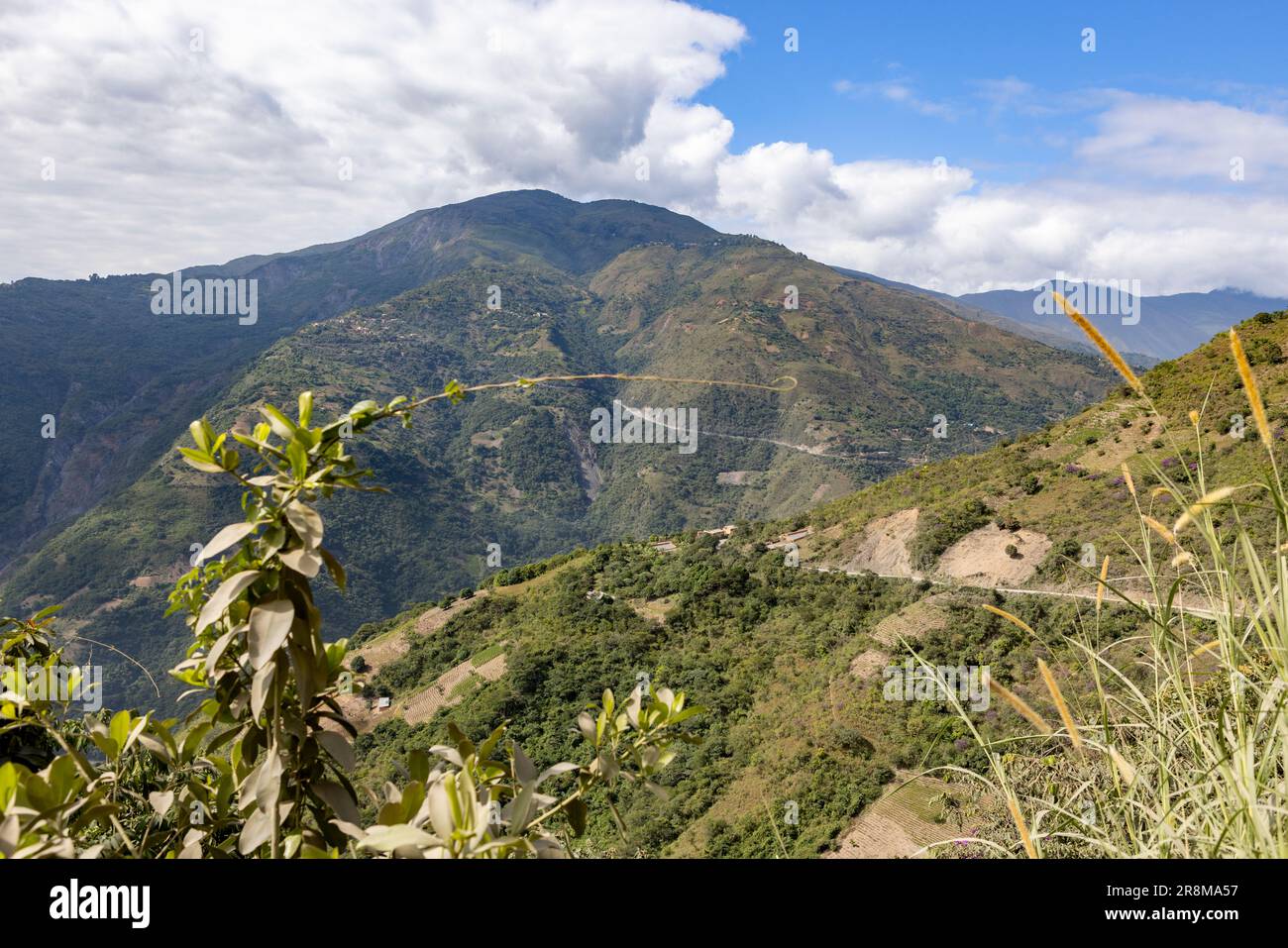 Scenic drive through the remote Bolivian Andes: passing small ...