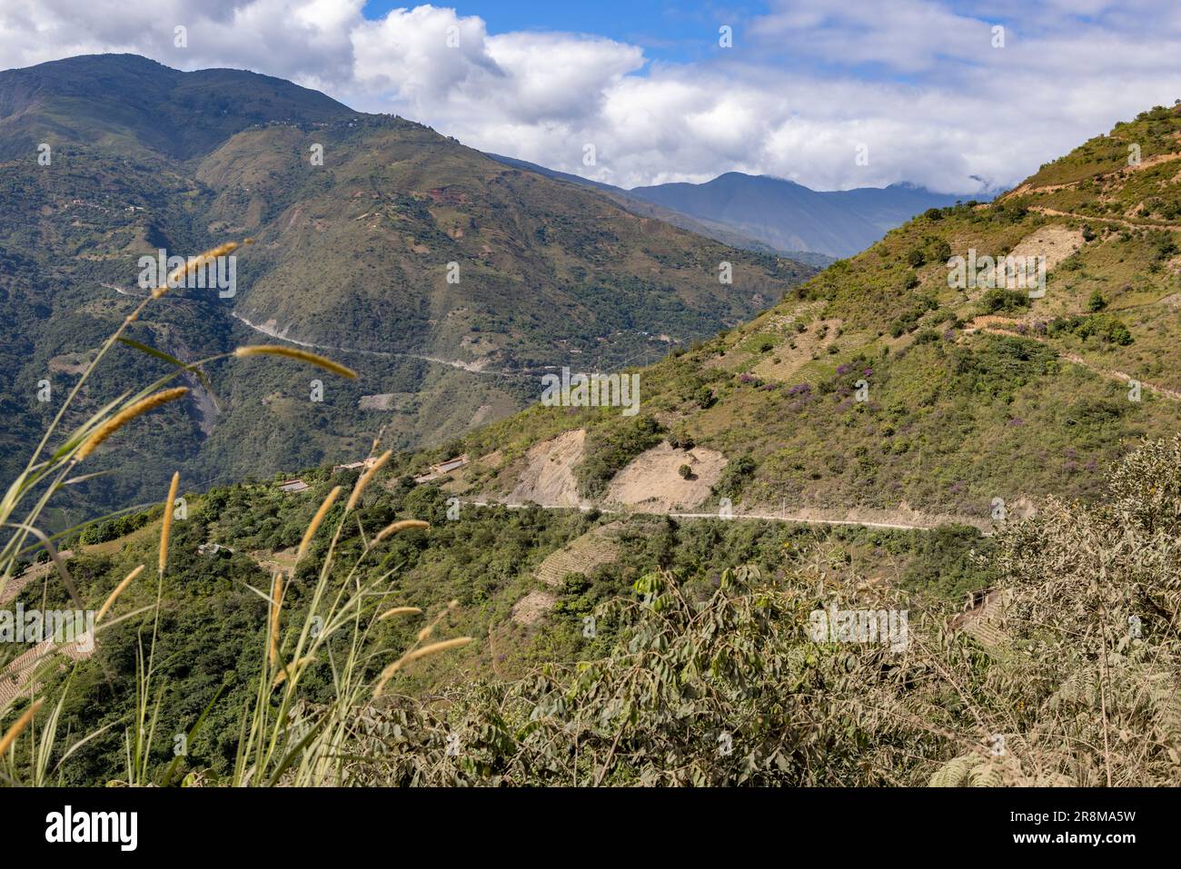 Scenic drive through the remote Bolivian Andes: passing small ...
