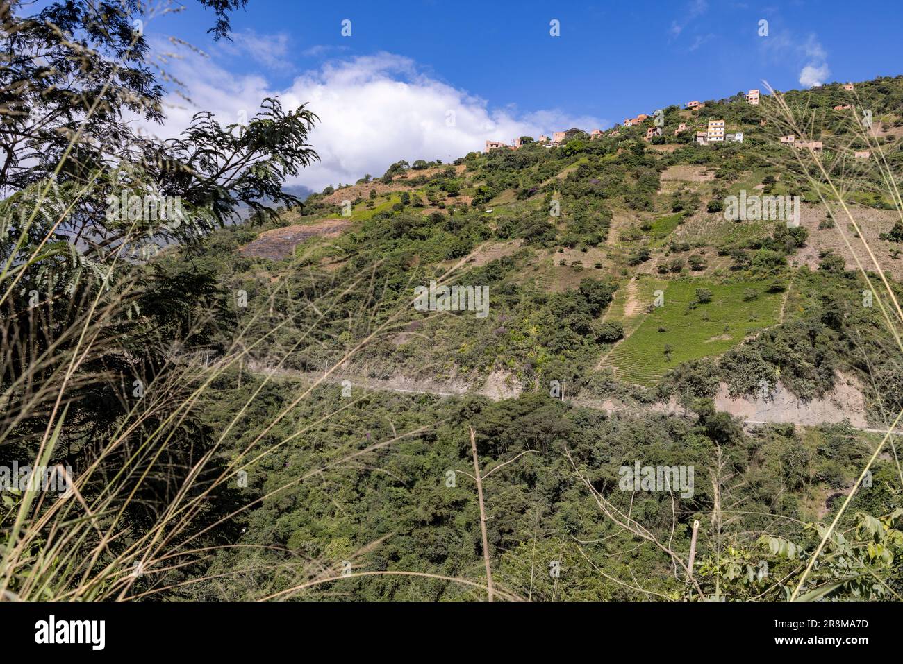 Scenic drive through the remote Bolivian Andes: passing small ...