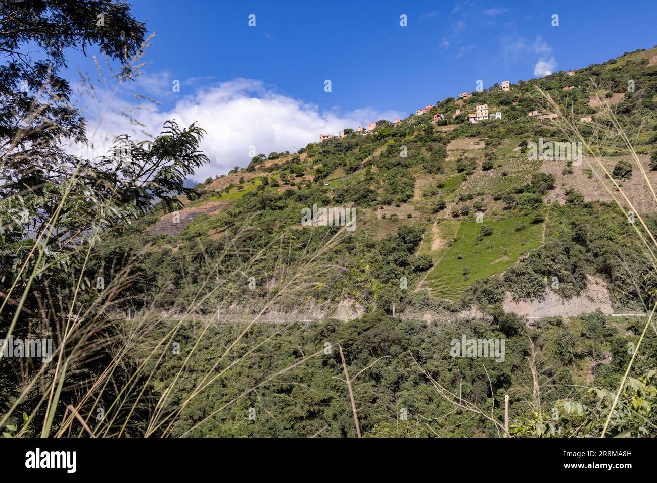 Scenic drive through the remote Bolivian Andes: passing small ...
