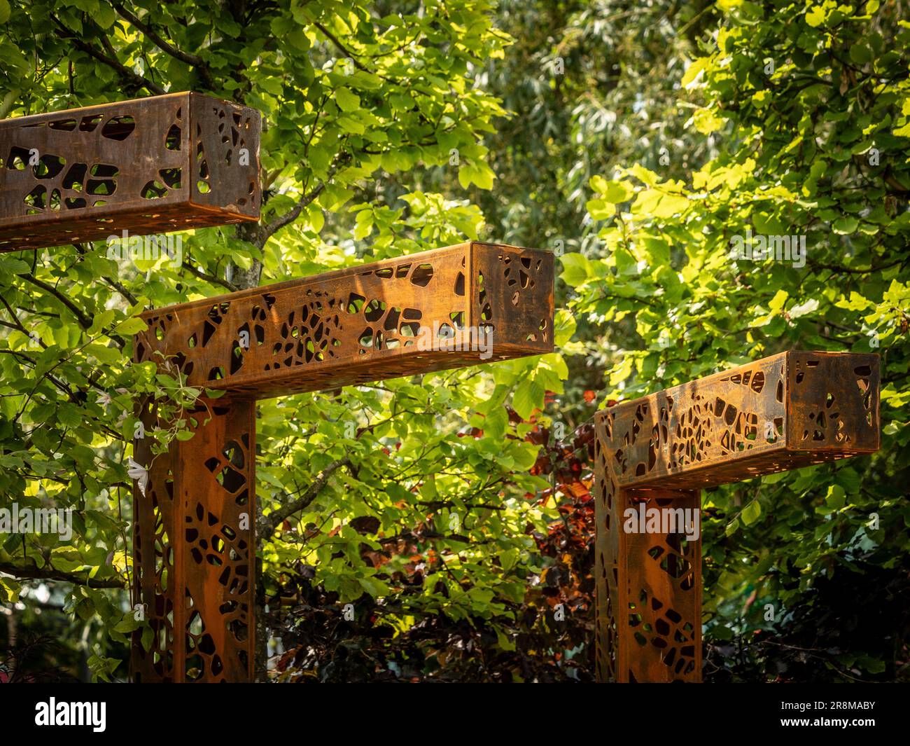 Close-up of decorative laser-cut Corten steel posts seen against ...