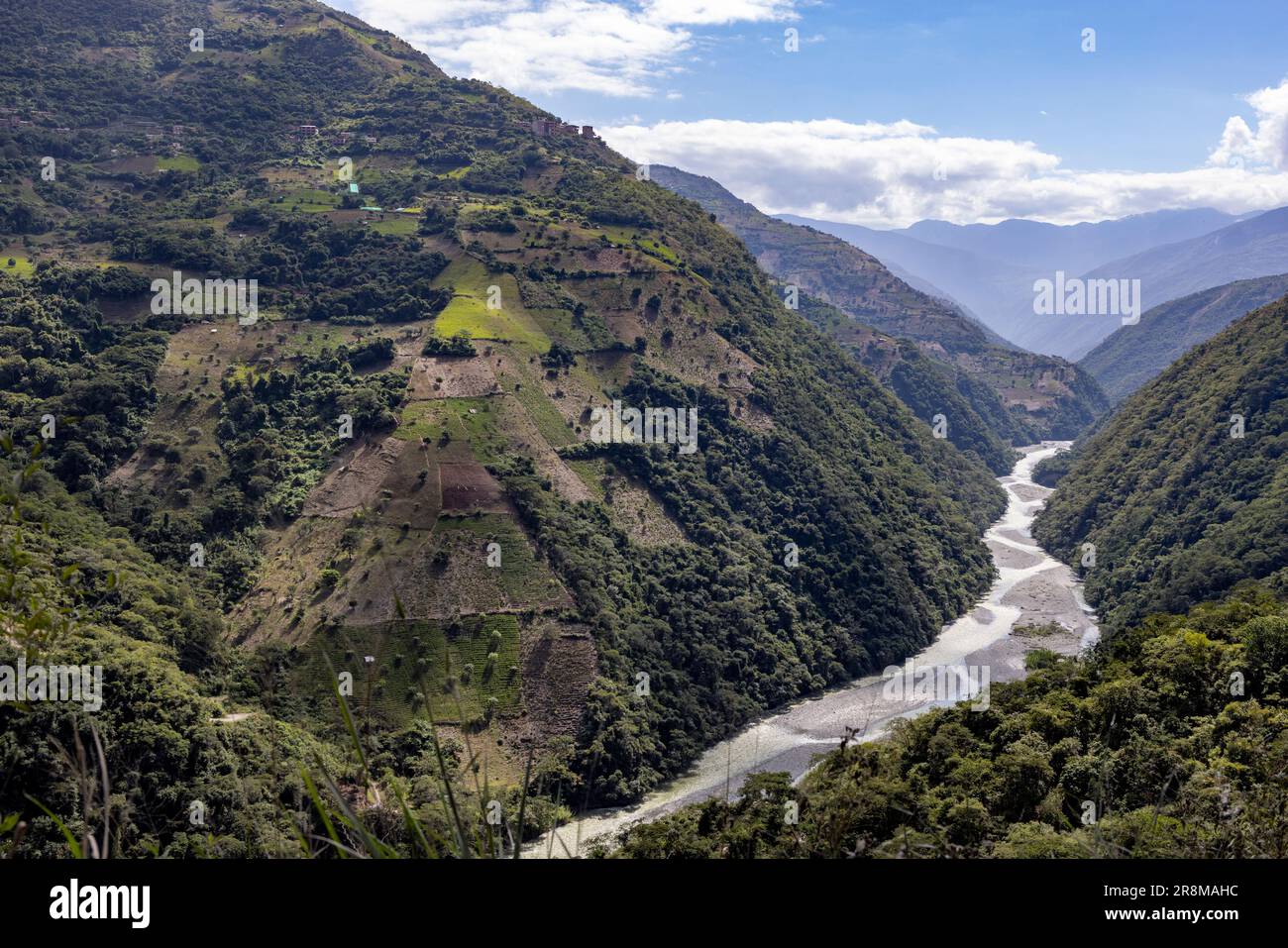 Scenic drive through the remote Bolivian Andes: passing small ...