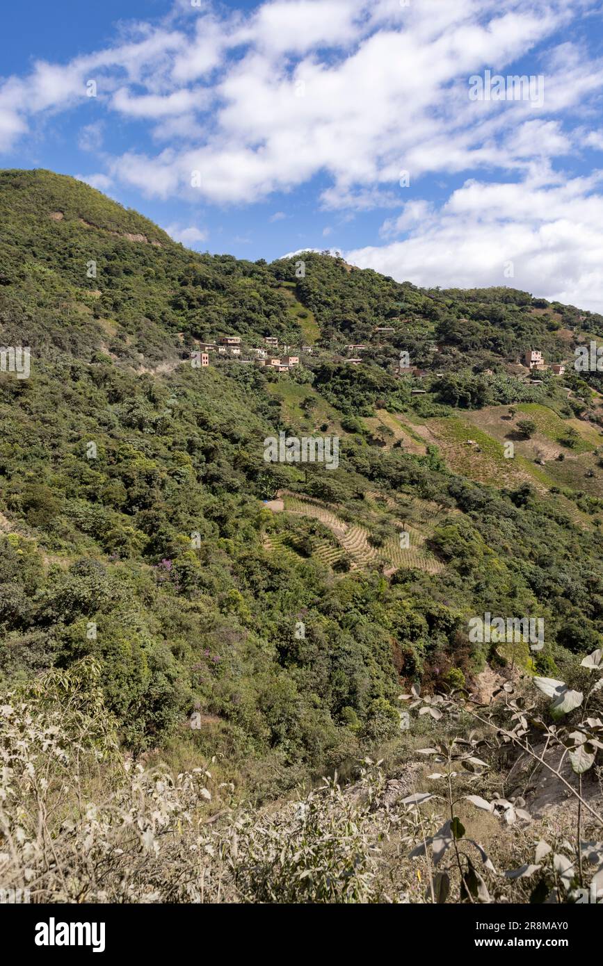 Scenic drive through the remote Bolivian Andes: passing small ...