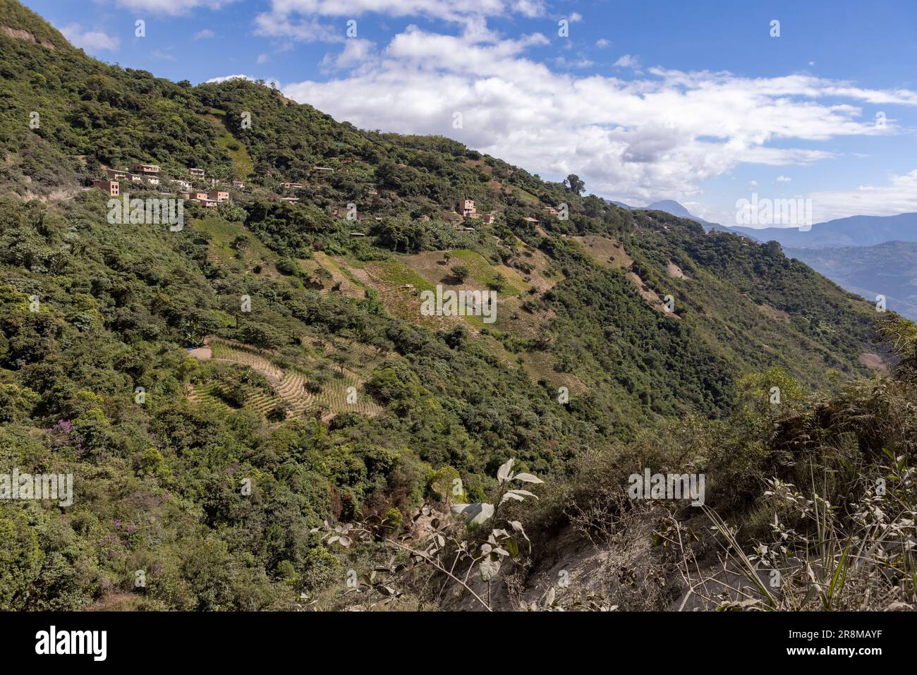 Scenic drive through the remote Bolivian Andes: passing small ...
