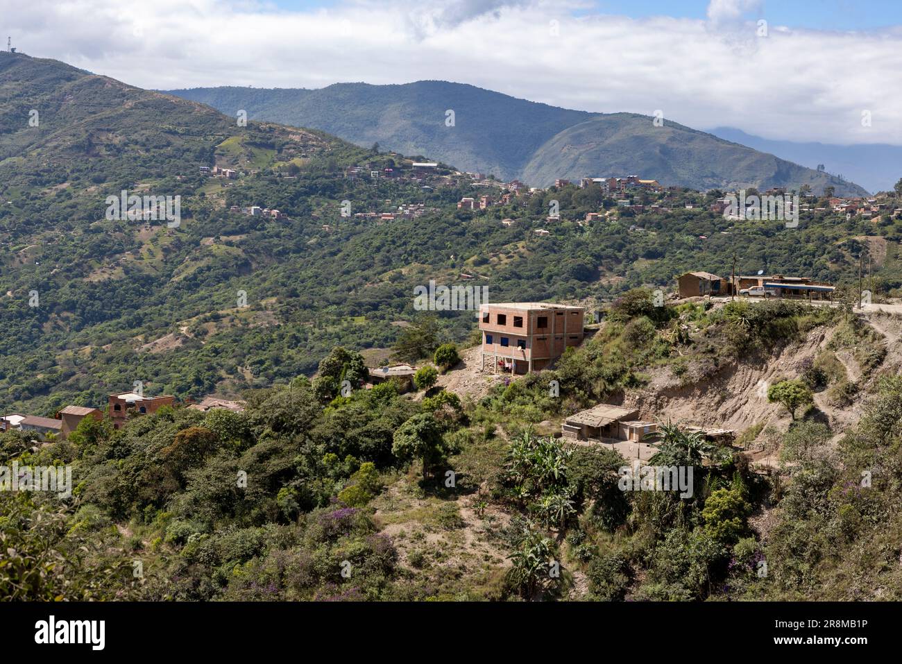 Scenic drive through the remote Bolivian Andes: passing small ...