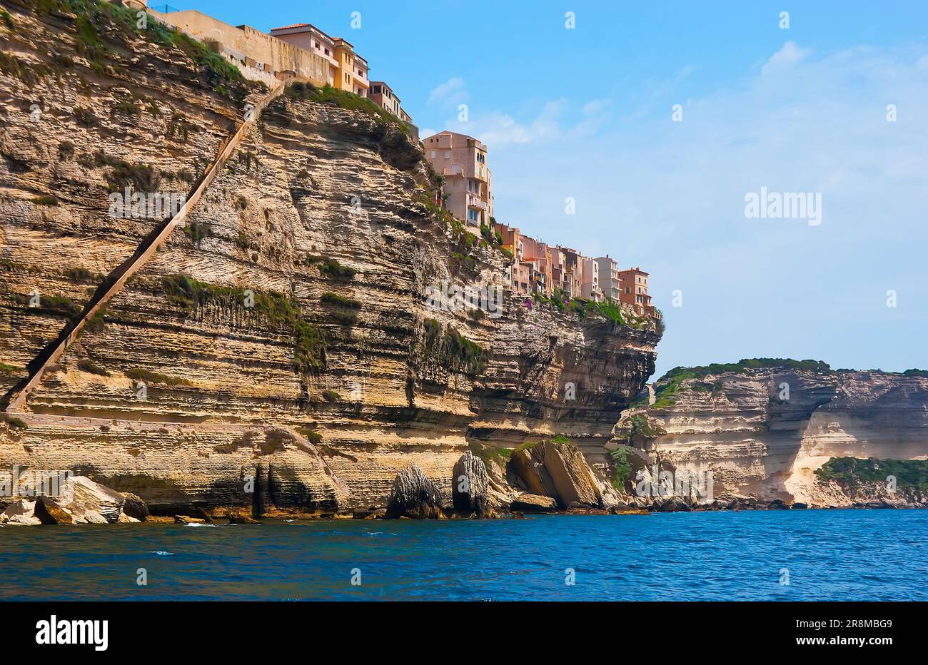 Bonifacio coast with massive limestone cliffs with medieval Staircase ...