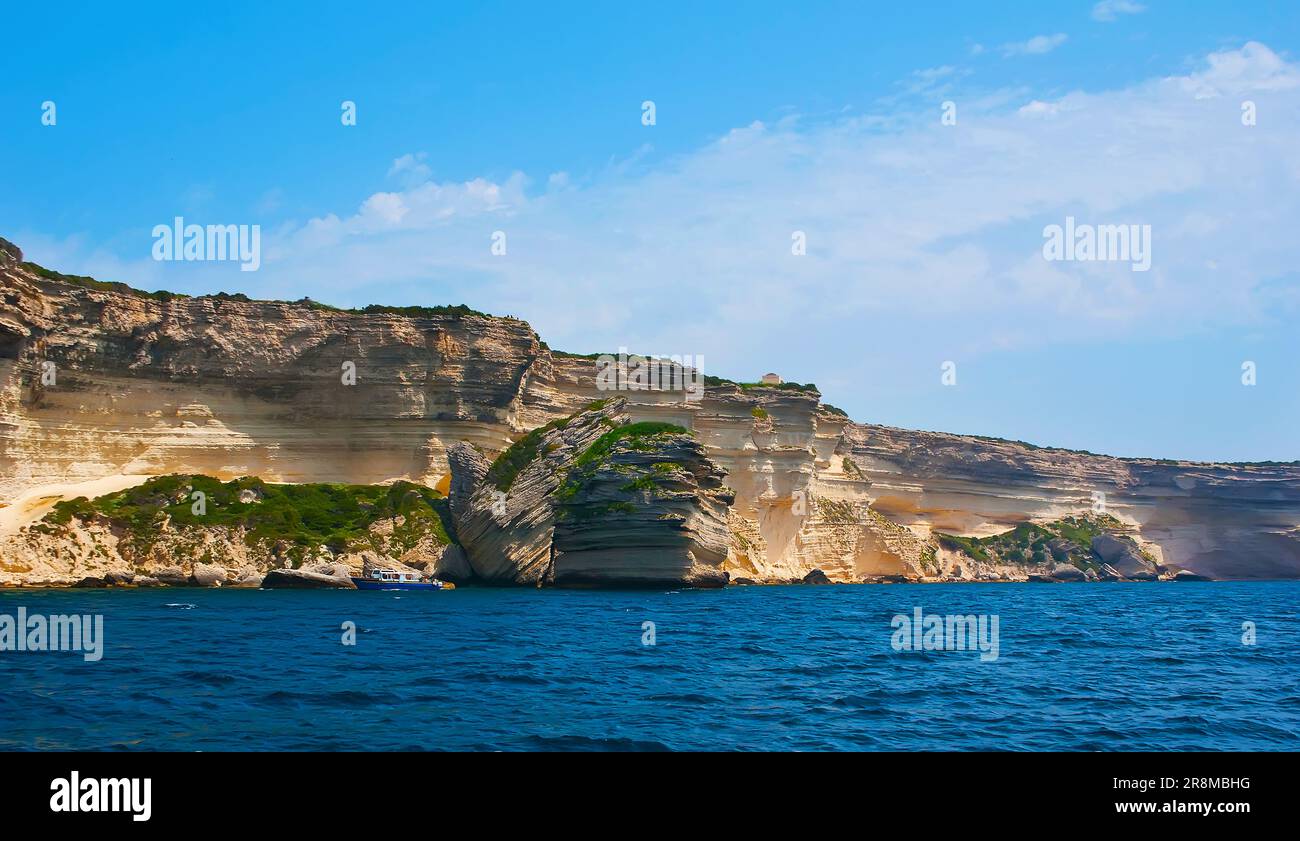 The stunning coastline of Bonifacio with yellow limestone cliffs and ...