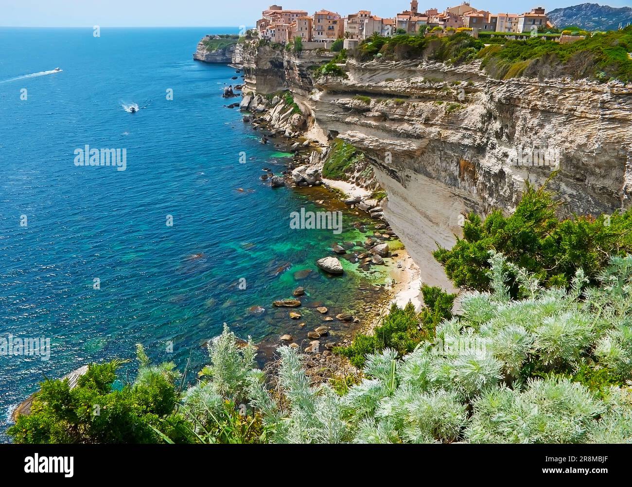 The picturesque white limestone cliffs of the Bonifacio coastline with ...