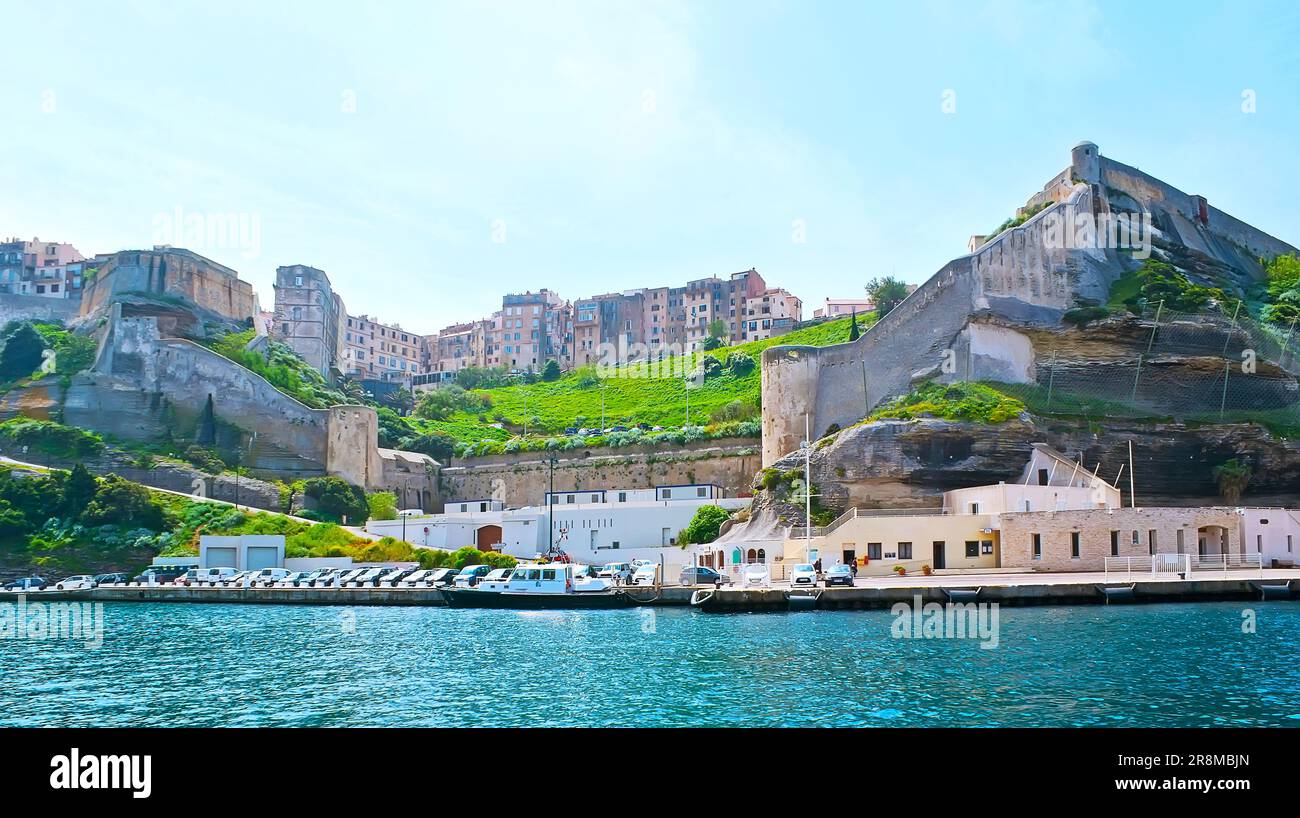 Watch the old buildings of Bonifacio, located atop the cliff, behind ...