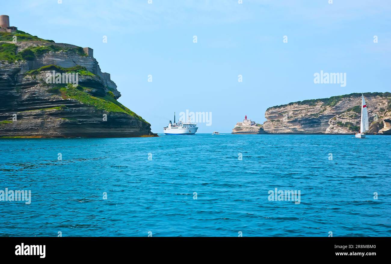 The white ship enters the harbor of Bonifacio, floating next to La ...