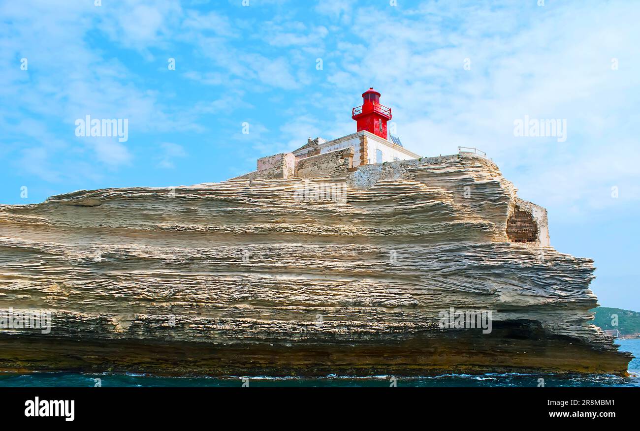 The tall limestone Punta San Antonio tip with red La Madonetta ...