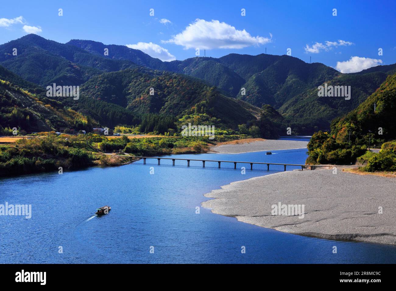 Sanri low water crossing, autumn colors, and a pleasure boat in the ...