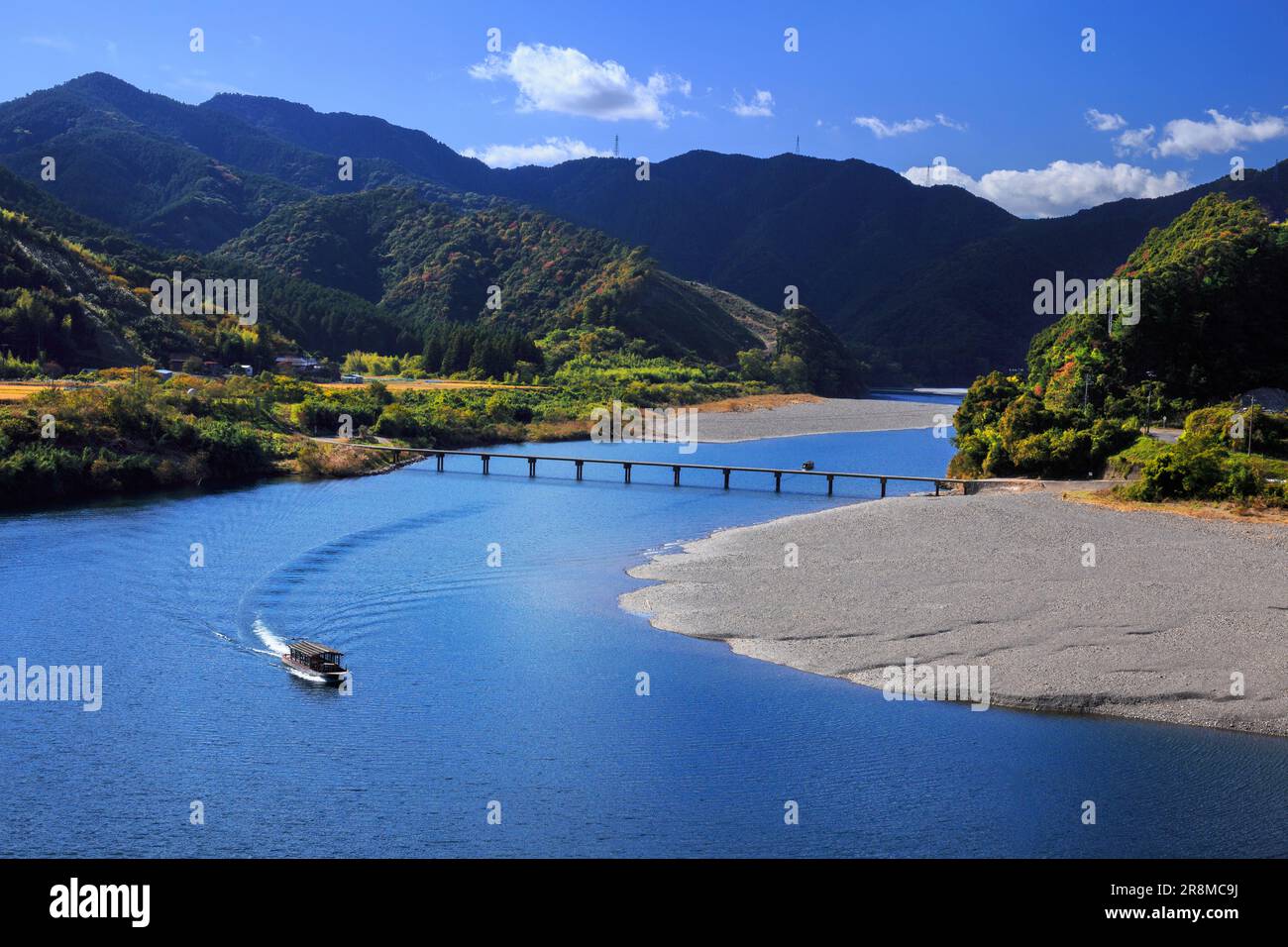 Sanri low water crossing, autumn colors, and a pleasure boat in the ...
