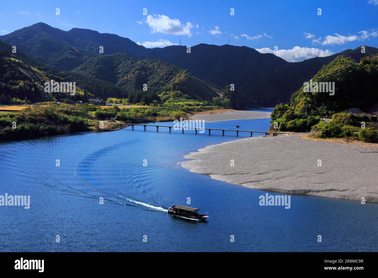 Sanri low water crossing, autumn colors, and a pleasure boat in the ...