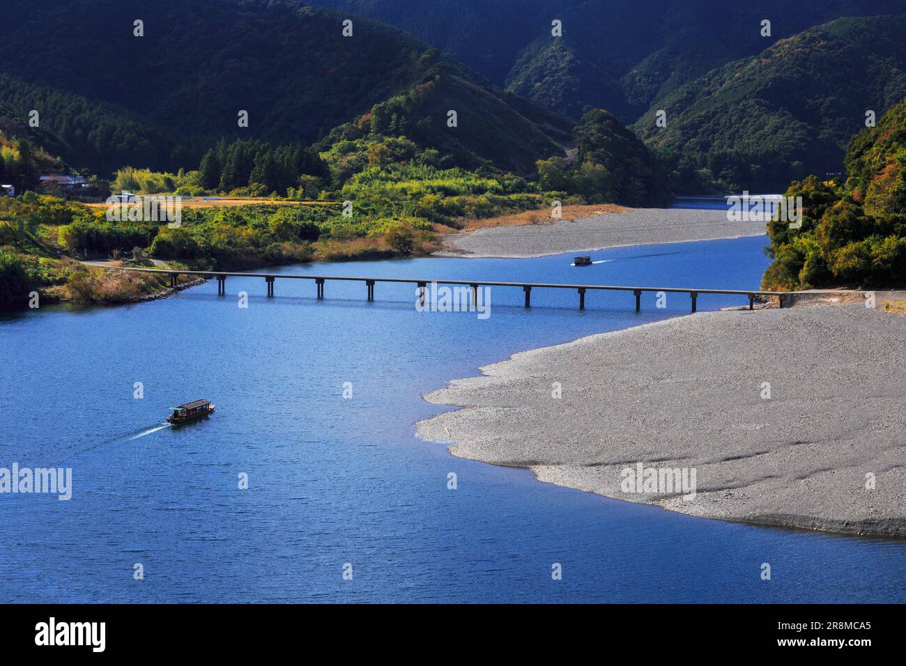 Sanri low water crossing, autumn colors, and a pleasure boat in the ...