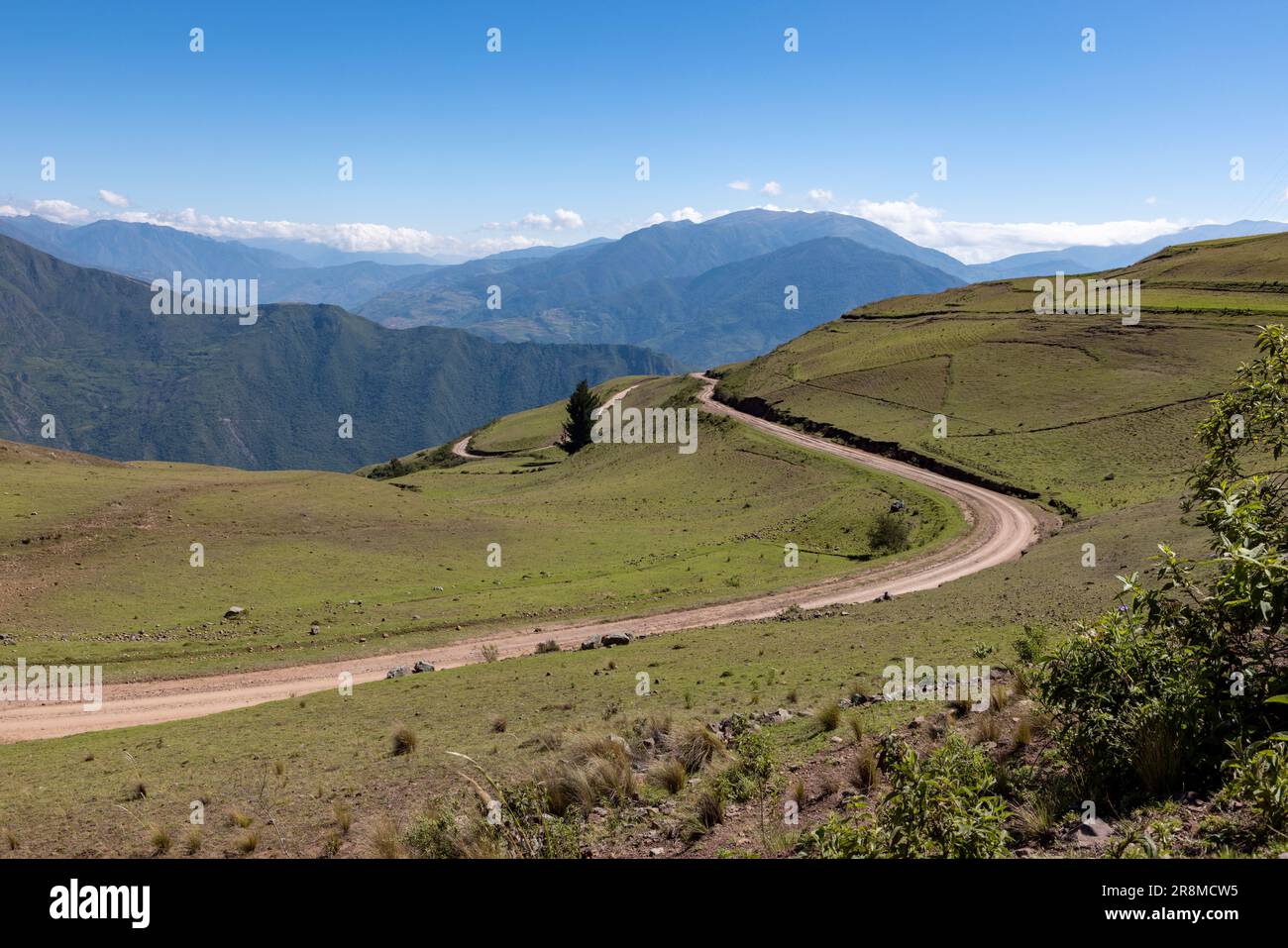 Scenic drive through a lush, forested and mountainous landscape in the ...