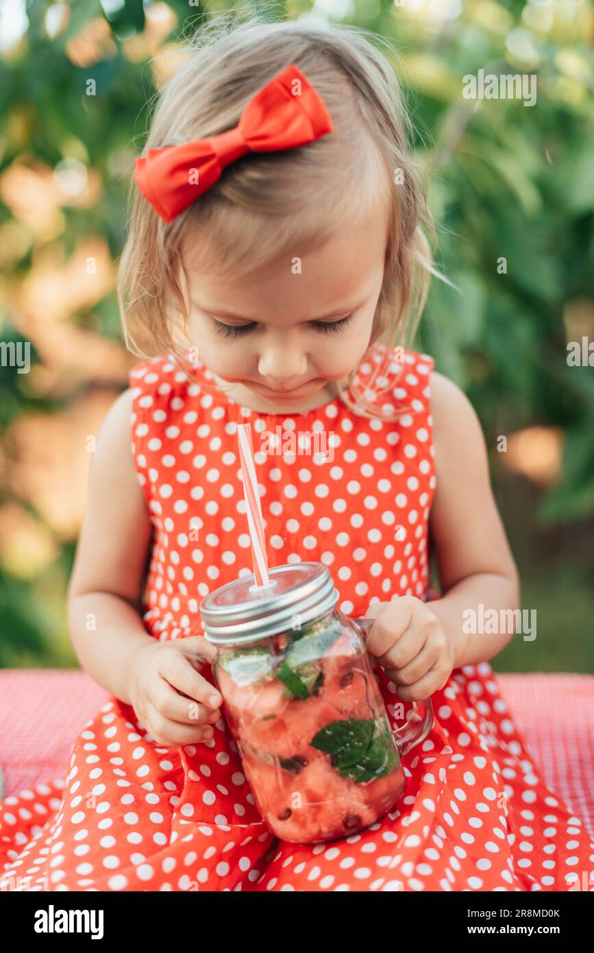 Lemonade Stand. Adorable little girl trying to sell lemonade ...