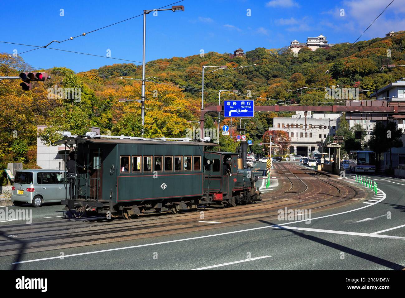 Botchan train and Matsuyama Castle Stock Photo - Alamy