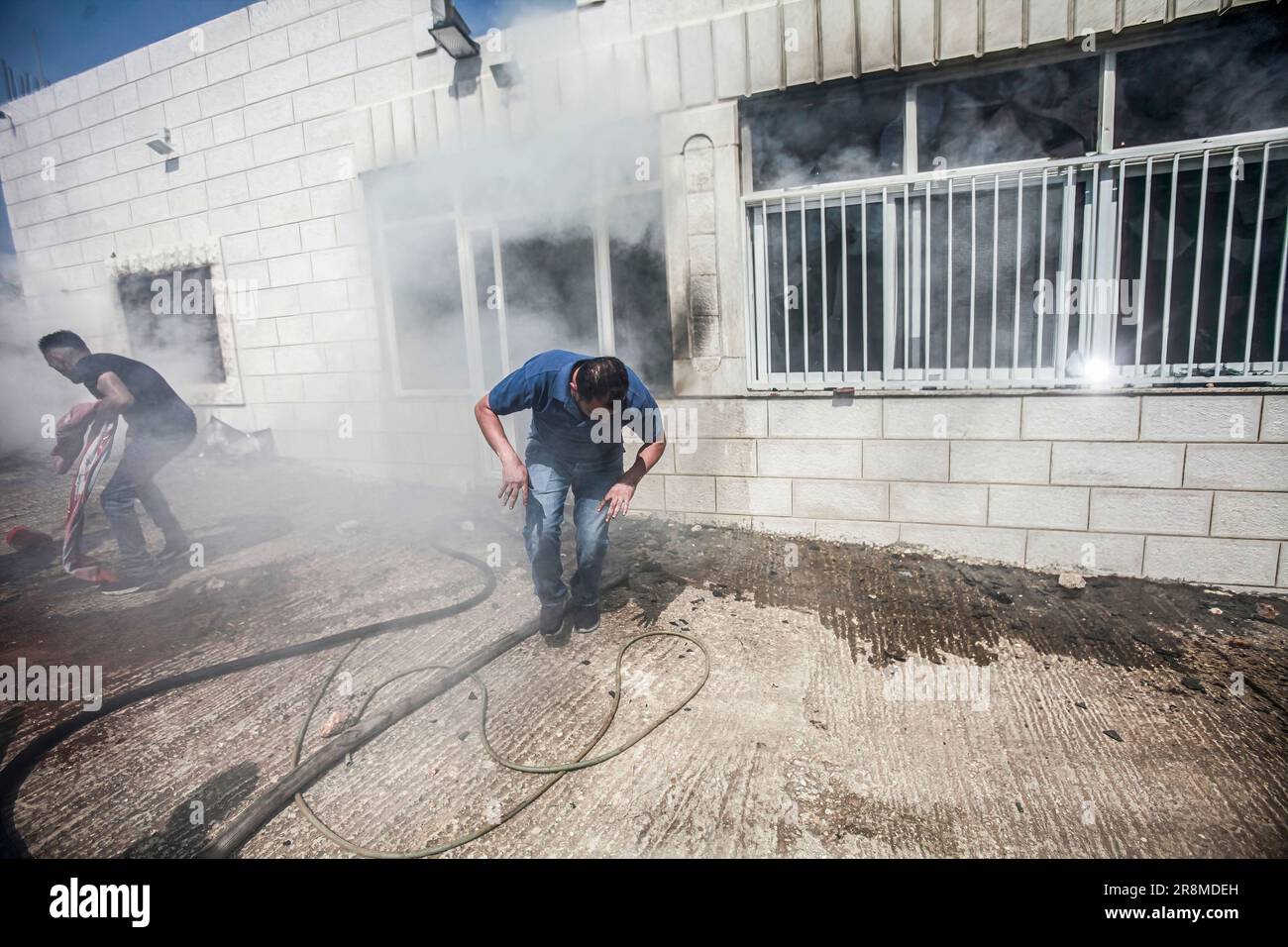 Ramallah, Palestine. 21st June, 2023. Palestinians rush out of their ...