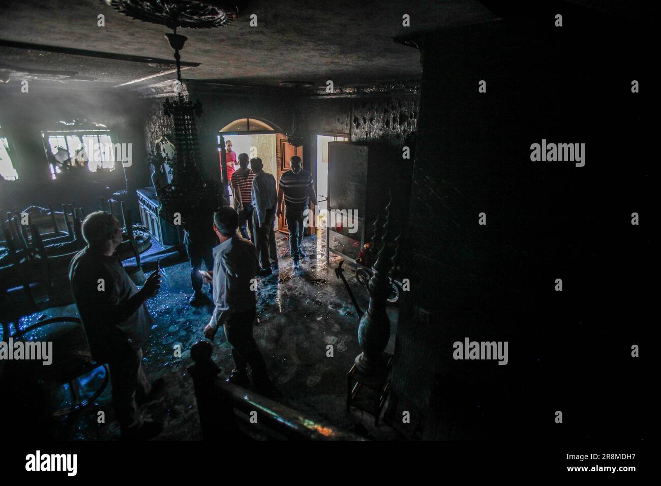 Ramallah, Palestine. 21st June, 2023. Palestinians inspect a destroyed ...