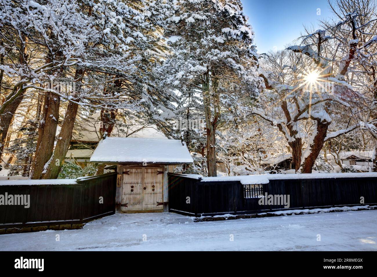 Sun over the piled up snow on Kakunodate samurai residences Stock Photo ...