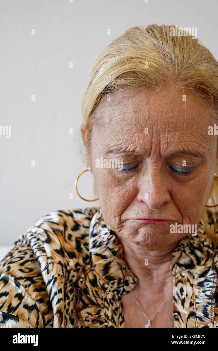 portrait of Sad and depressed old woman. A lady with mental problems ...