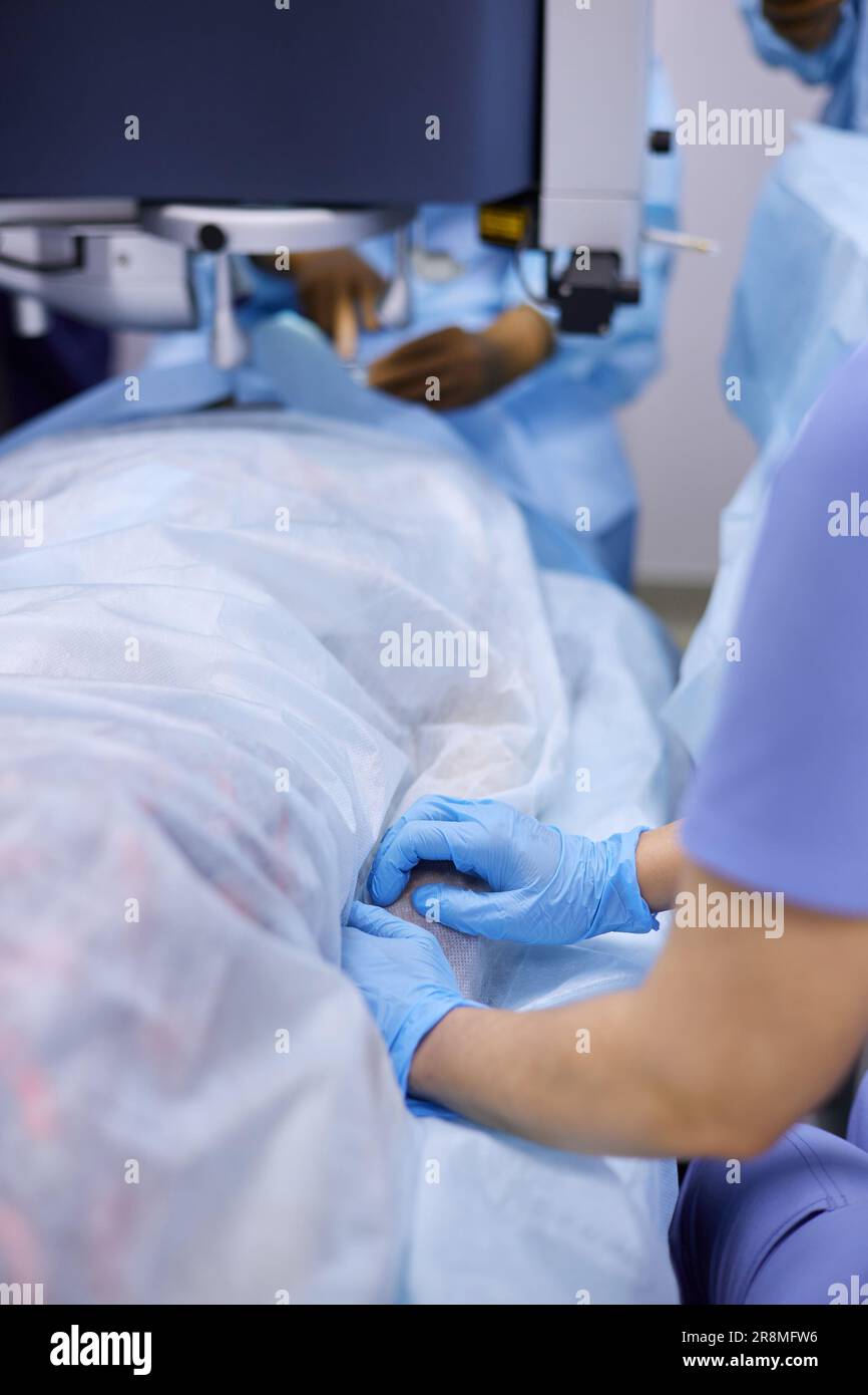 Surgeon performing eye surgery microscope hi-res stock photography and ...