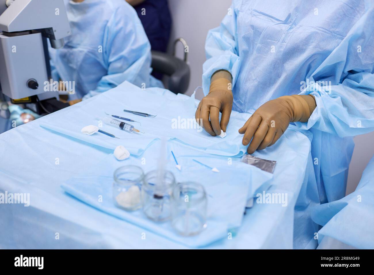 Surgeon performing eye surgery microscope hi-res stock photography and ...