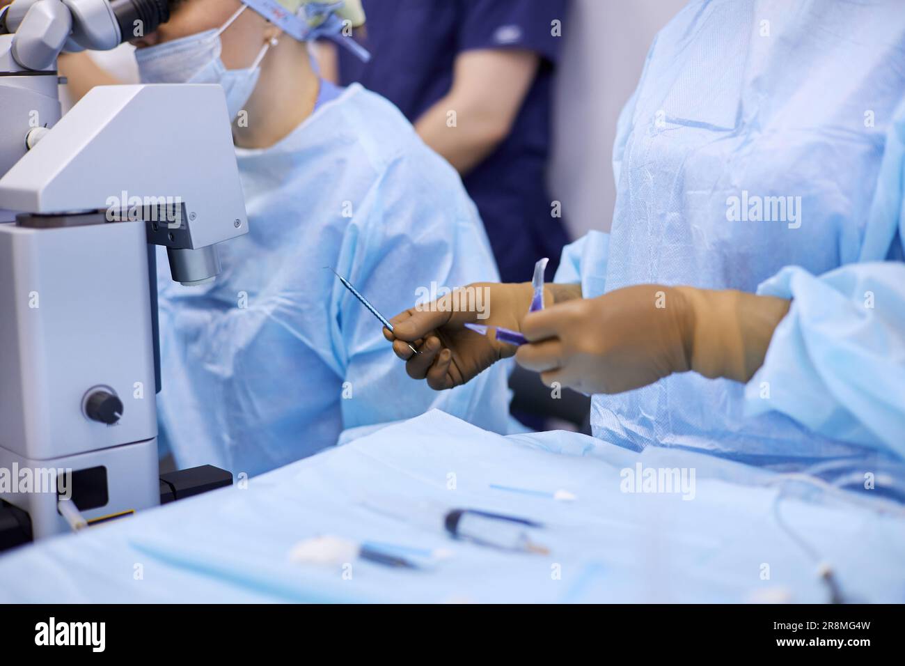 Surgeons performing eye surgery in the operating room Stock Photo - Alamy