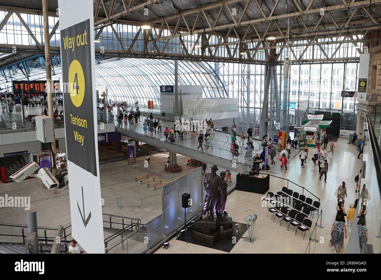 People walk past the National Windrush Monument in Waterloo Station in ...