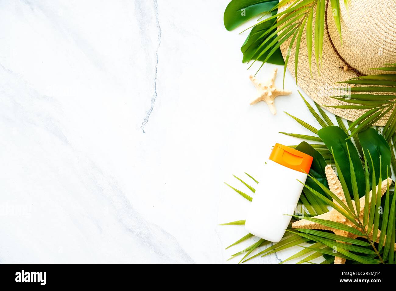 Sun screen skin care product on blue flat lay Stock Photo - Alamy