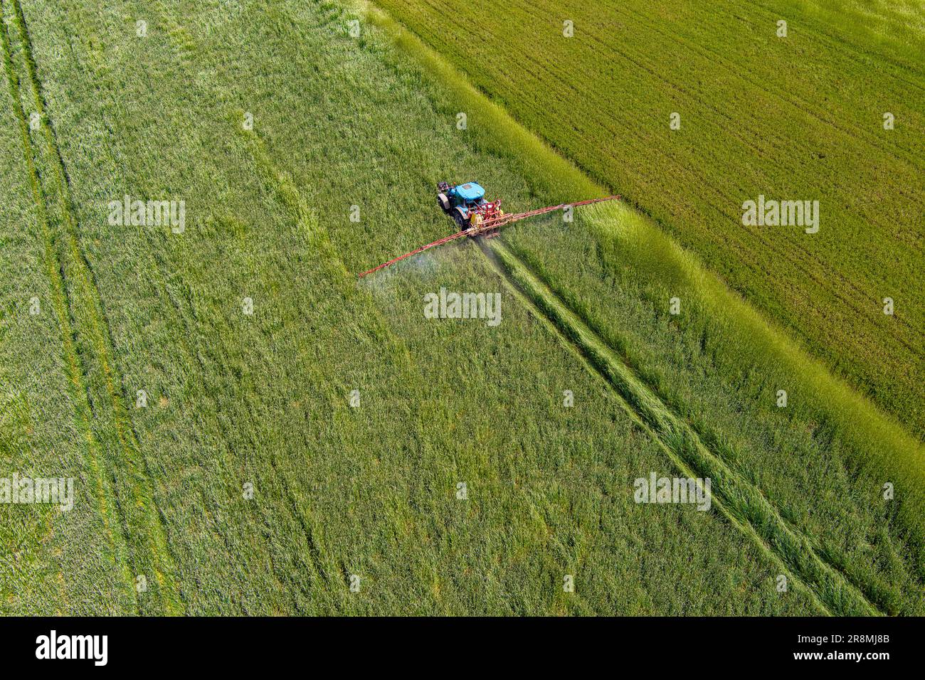 Tractor cultivating field at spring, aerial view, drone shot Stock ...