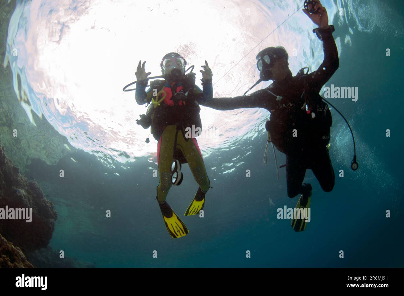 8 year-old girl diving with instructor, Post dive site, Menjangan ...