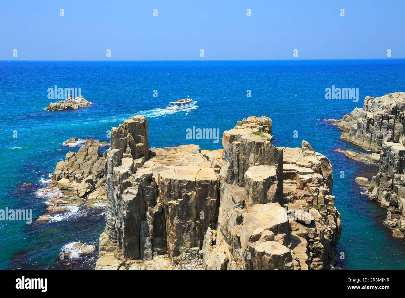 Tojinbo and a sightseeing boat Stock Photo - Alamy