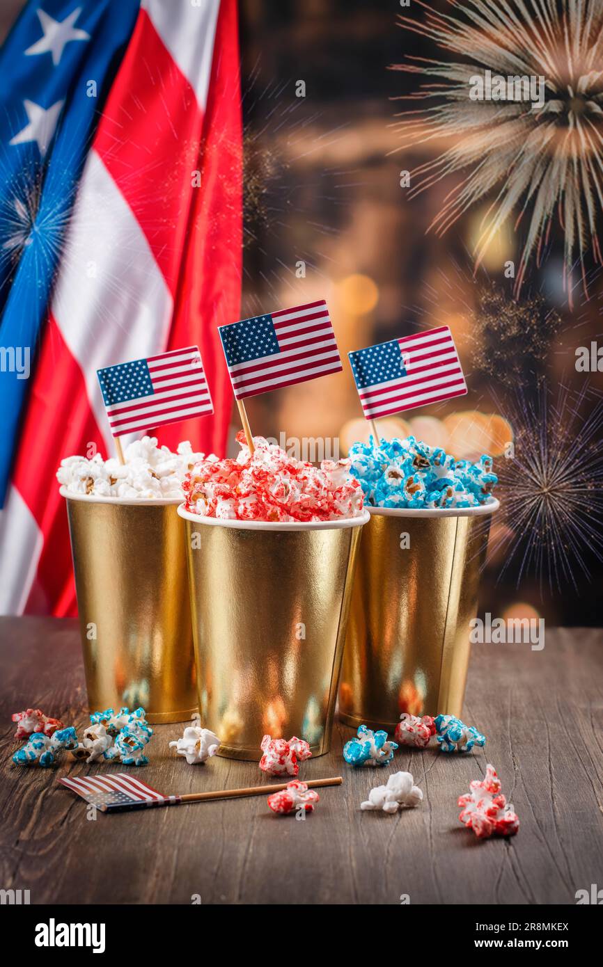 Golden paper cups with red, blue, white popcorn. US colors for 4th july ...