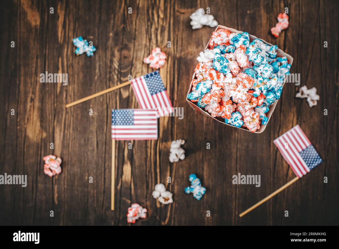 Golden paper cups with red, blue, white popcorn. US colors for 4th july ...