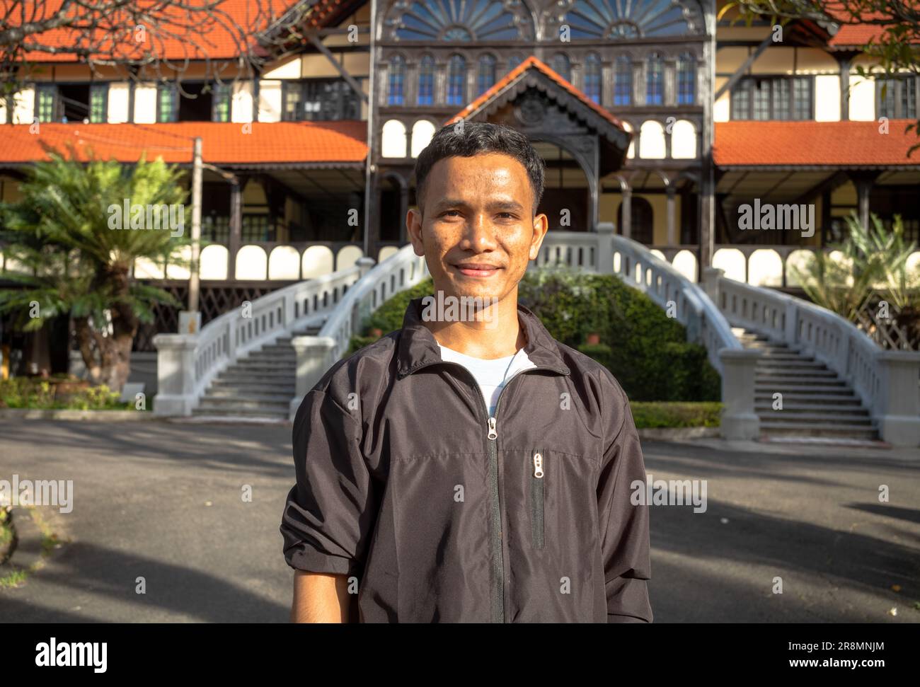 A seminarian, or trainee priest, stands in front of the Bishop's House ...