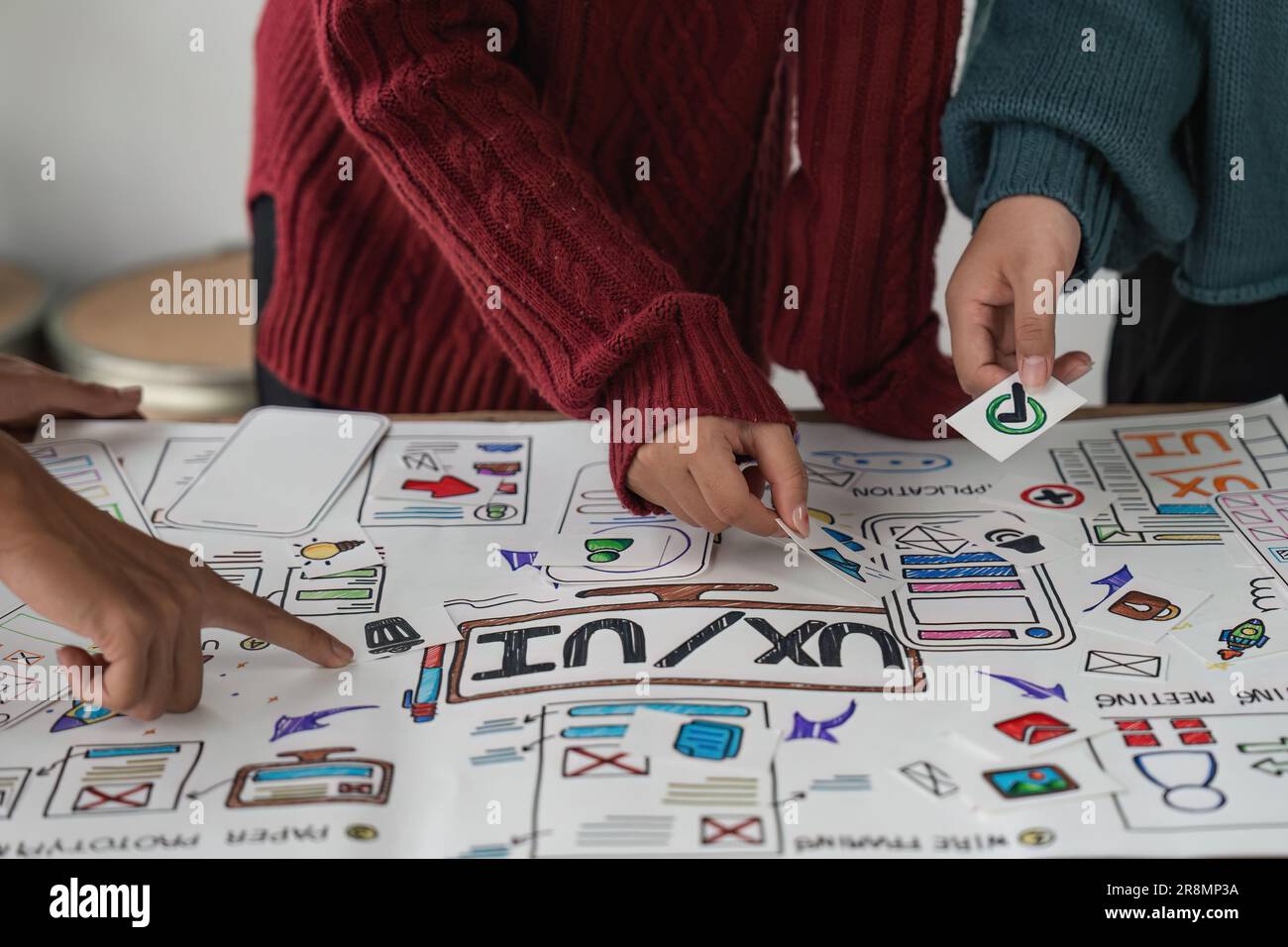 Creative designer choosing color samples for mobile responsive website ...