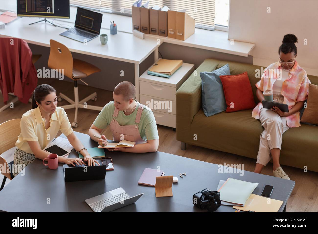 Top view at work process in modern office with all female business team ...