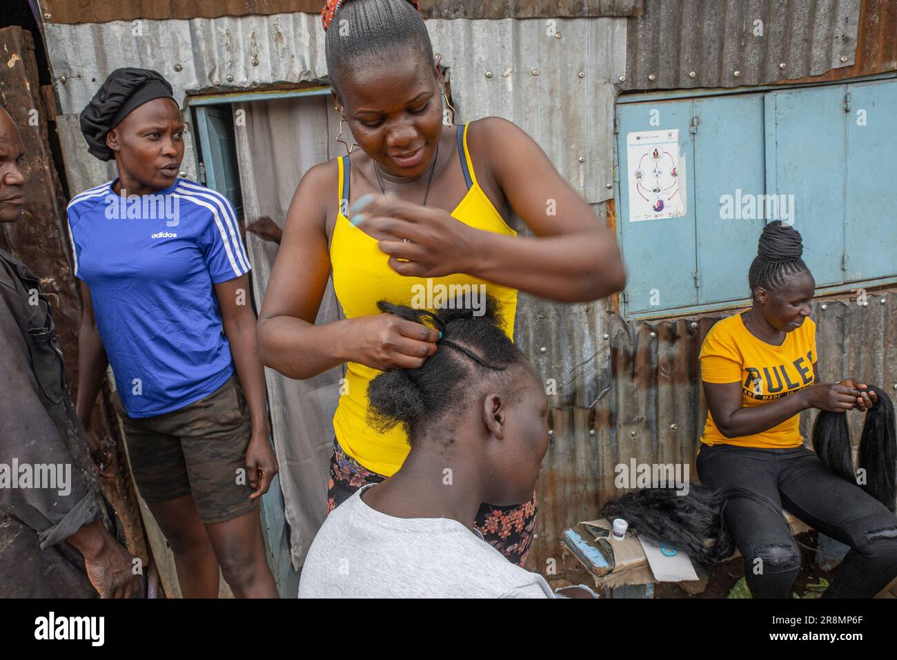 Nairobi, Kenya. 20th June, 2023. A group of woman braiding hair by the ...