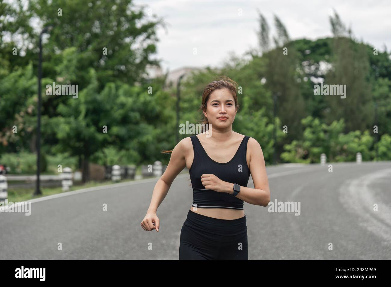 Jogging woman running in park on beautiful day off. Sport fitness model ...